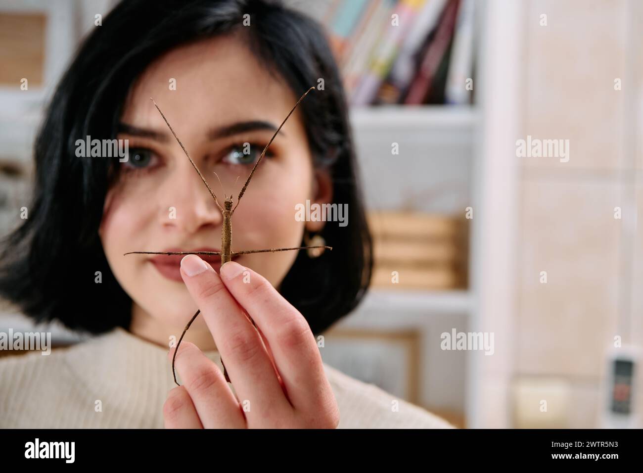 Young Woman Captured in a Beautiful Moment with Her Stick Insect ...