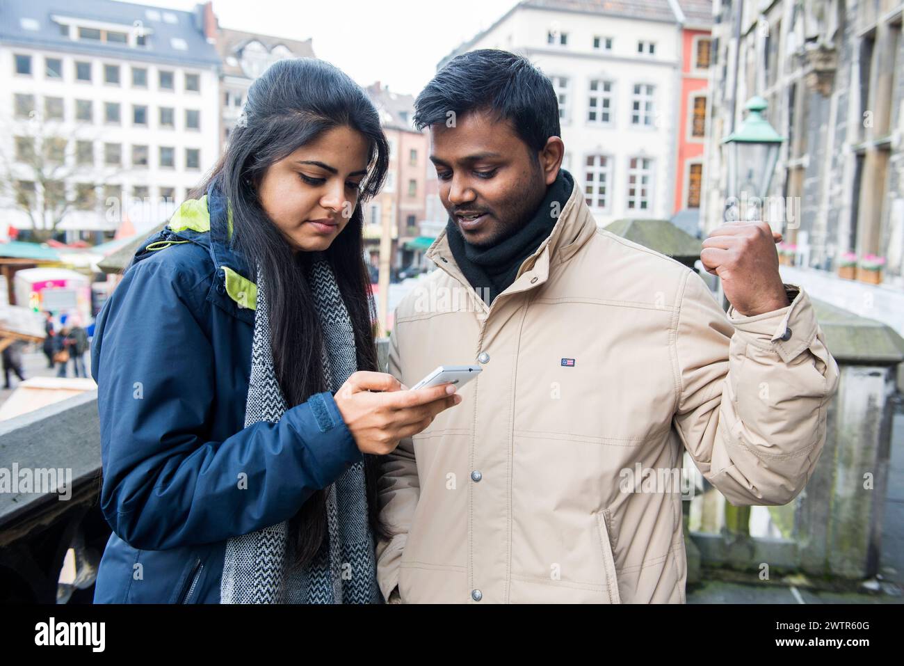 Couple Navigating a City Aachen, Germany. Young, Indian couple of ...