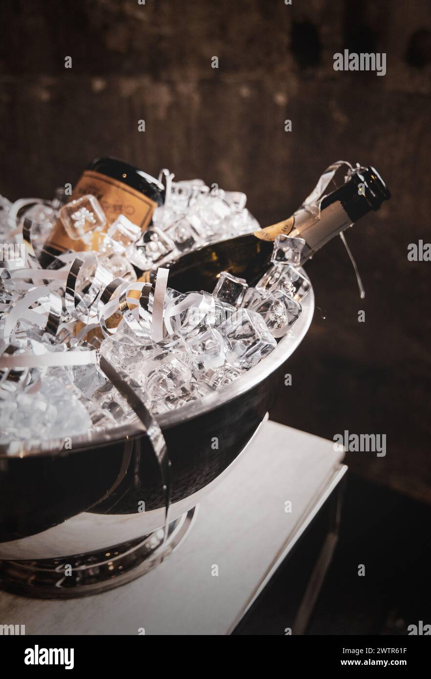 Empty vintage champagne bottles in a ice filled champagne bucket Stock ...