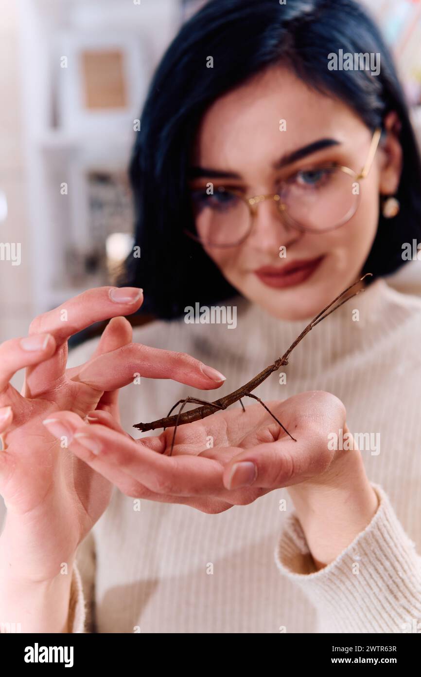 Young Woman Captured in a Beautiful Moment with Her Stick Insect ...