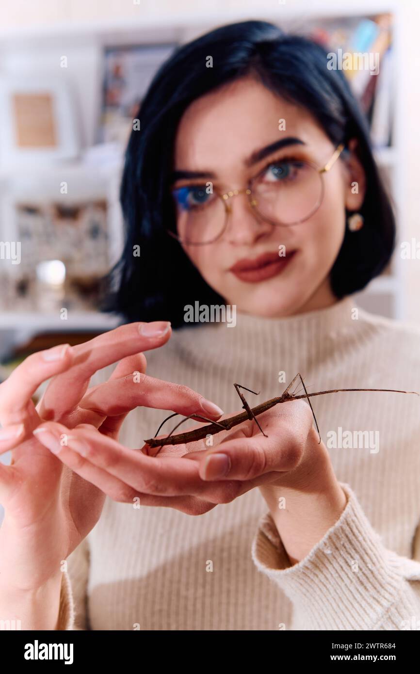 Young Woman Captured in a Beautiful Moment with Her Stick Insect ...