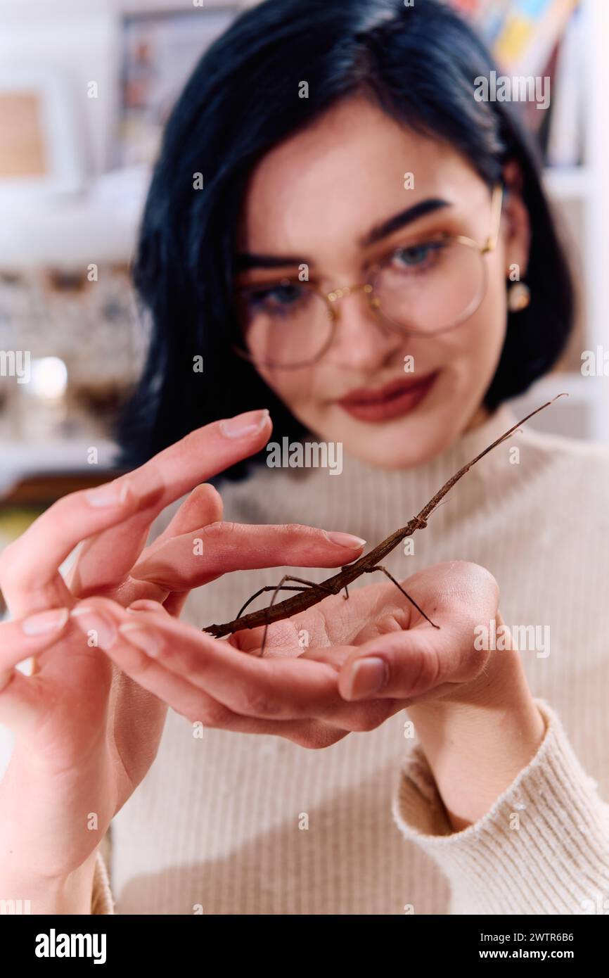 Young Woman Captured in a Beautiful Moment with Her Stick Insect ...