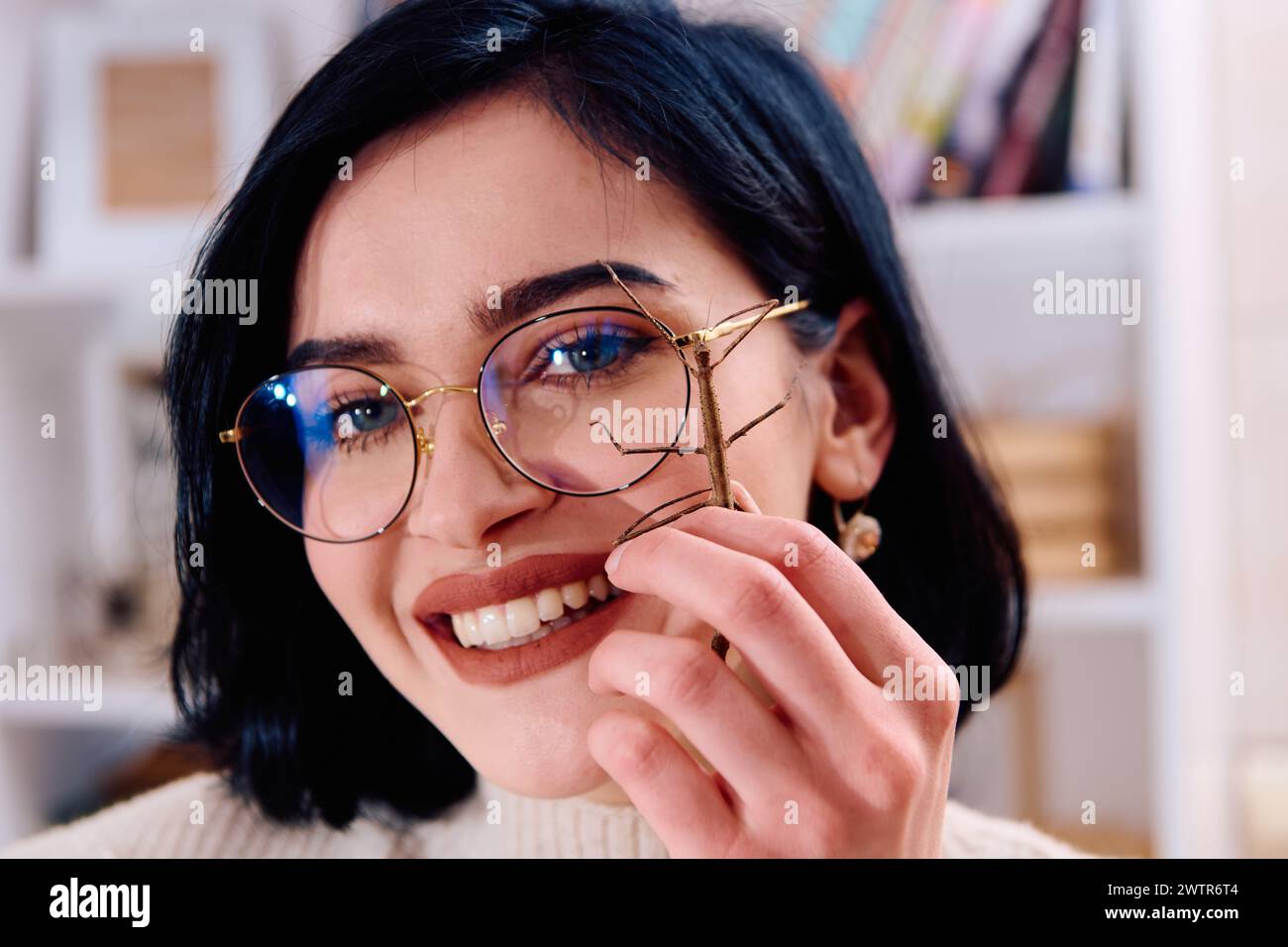 Young Woman Captured in a Beautiful Moment with Her Stick Insect ...