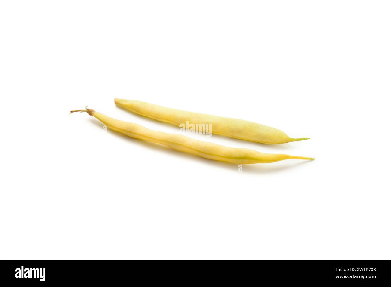 Several pods of raw yellow pods of haricot isolated on white background ...