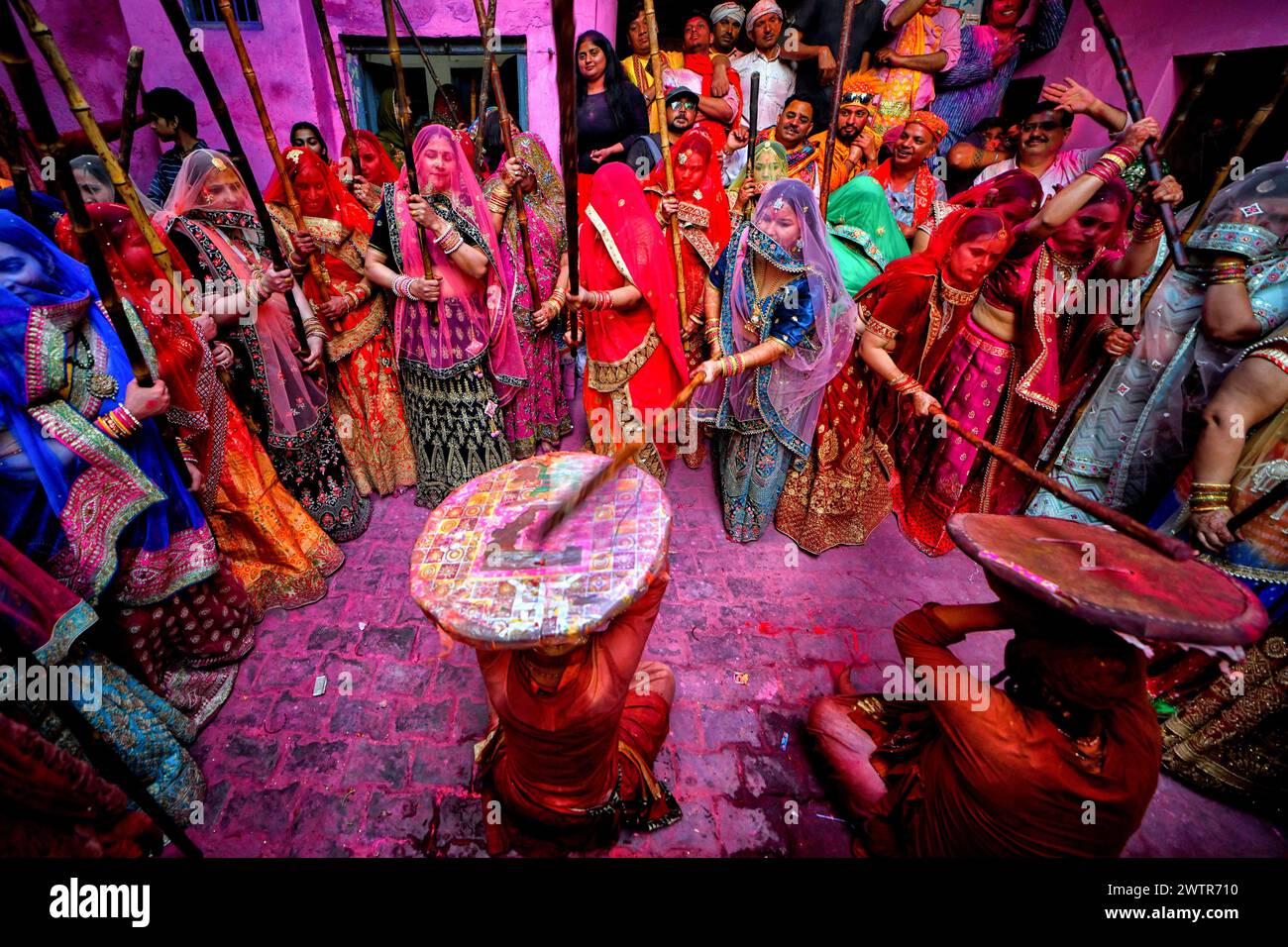 A group of Women seen holding sticks (Lathi) ritually for beating Hindu ...