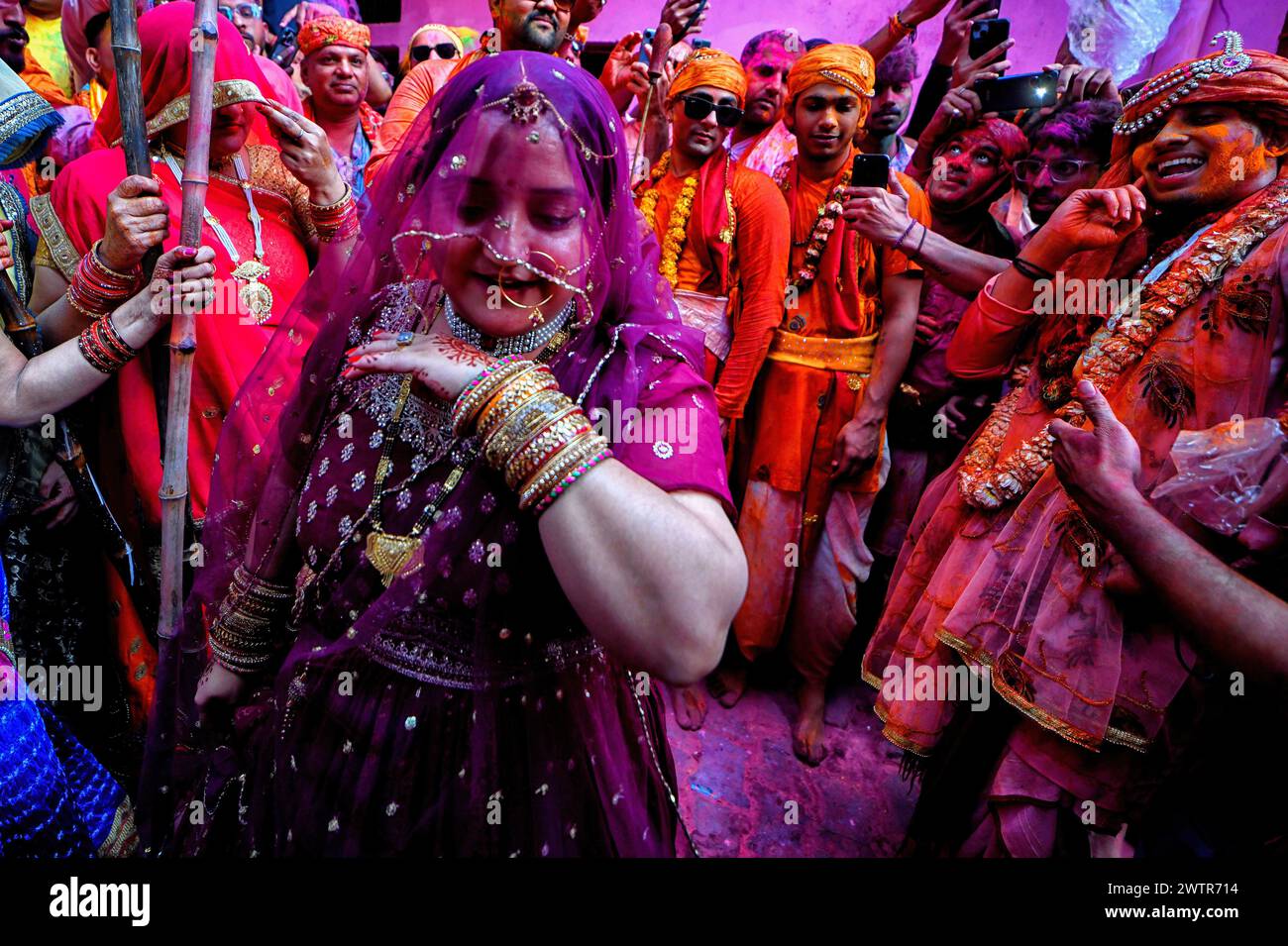 A woman devotee sings in front of the male devotees as per the ...