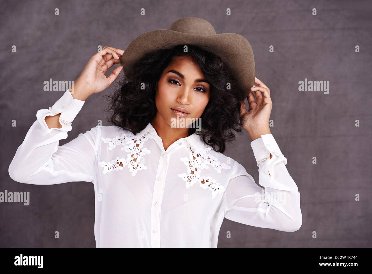 Portrait, studio and woman with cowboy fashion, confidence and relax ...