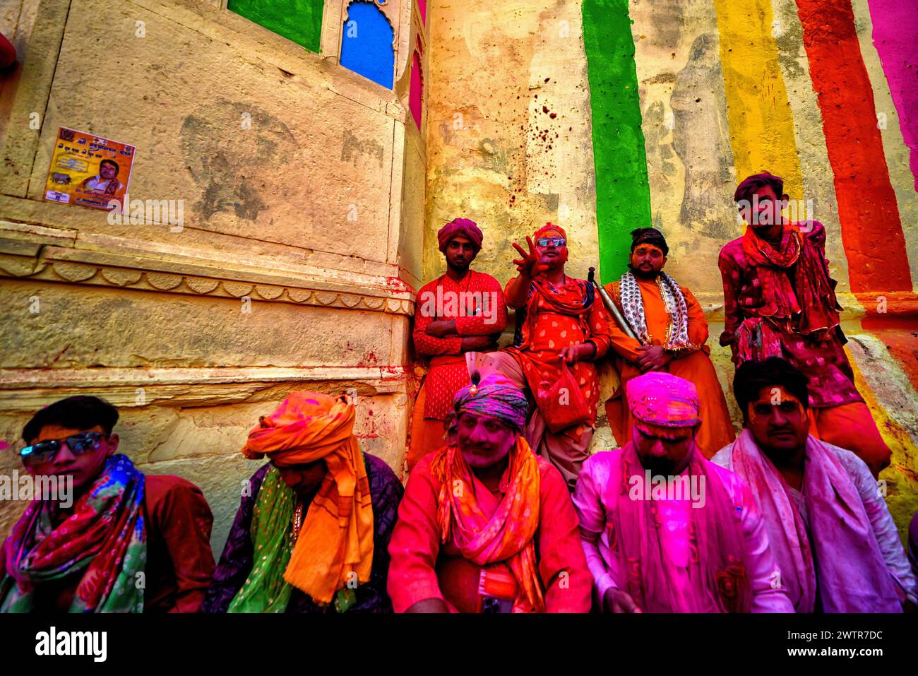 Men are covered with colourful powder during the Lathmar Holi Festival ...