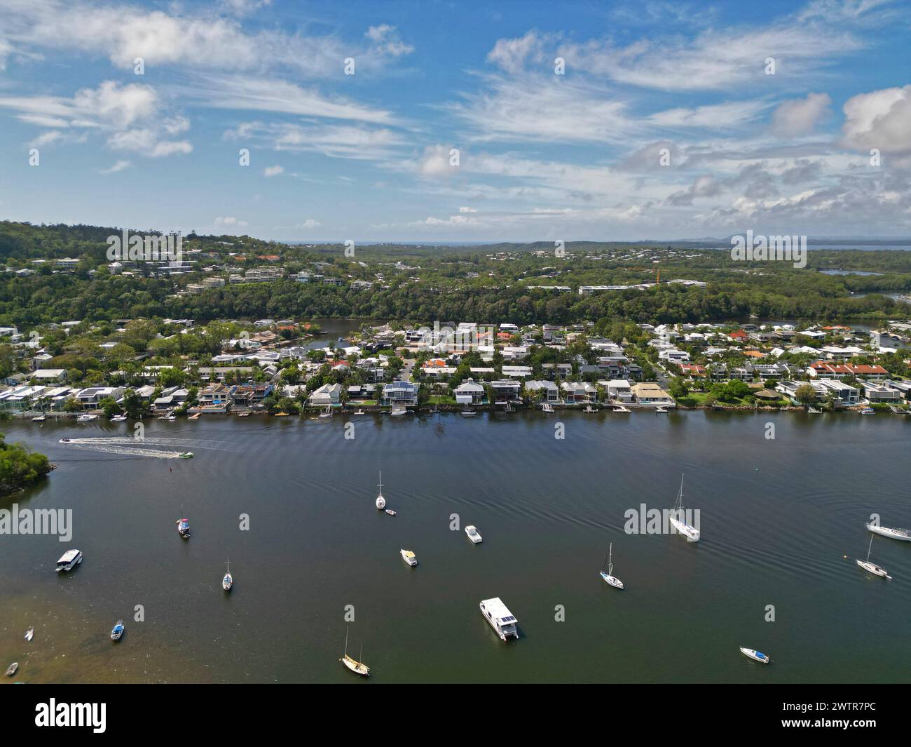 Multiple boats float in the water at Noosa River, Noosa Heads, Noosa ...