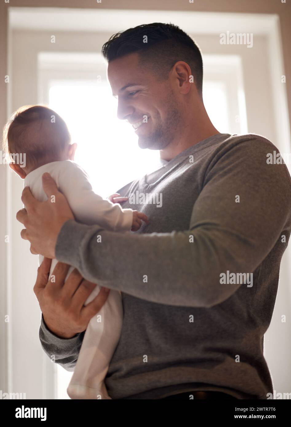 Father and baby, love and happy in a house with care, trust and child ...