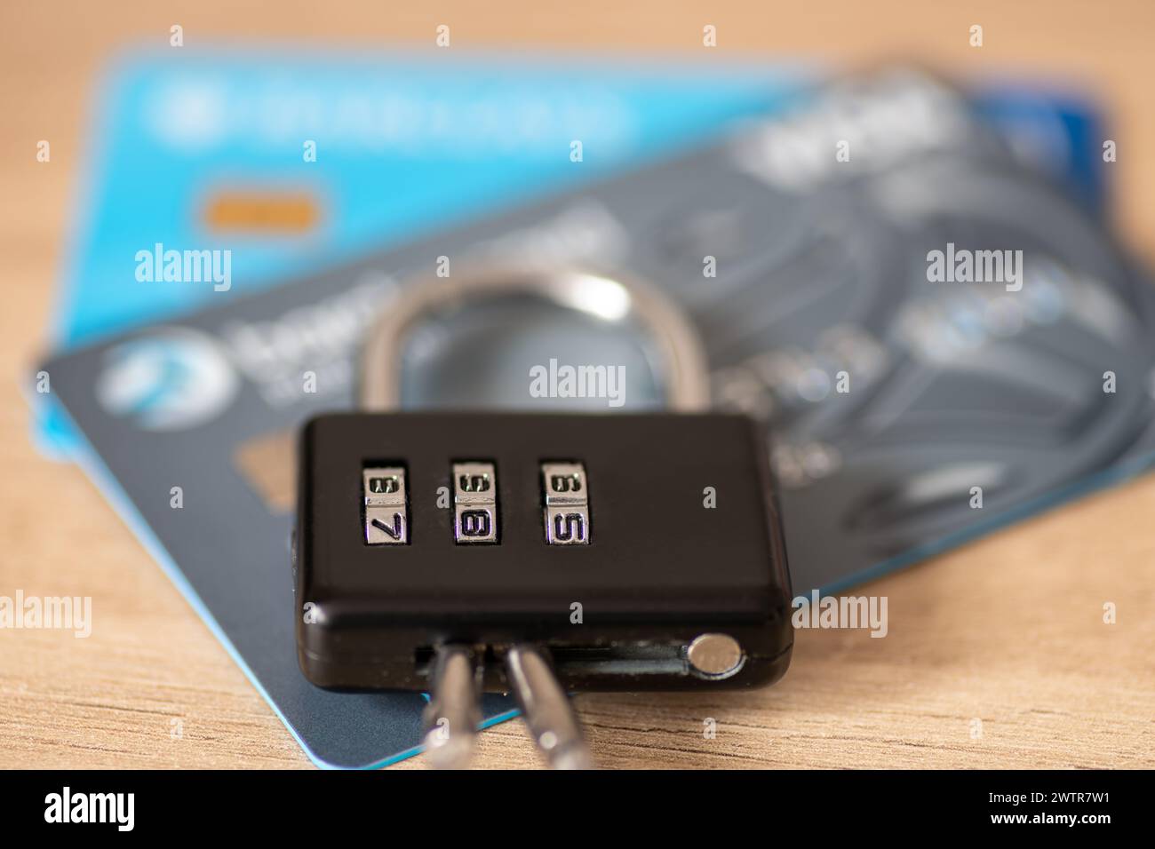 A credit, debit bank card security concept with a combination pad lock ...