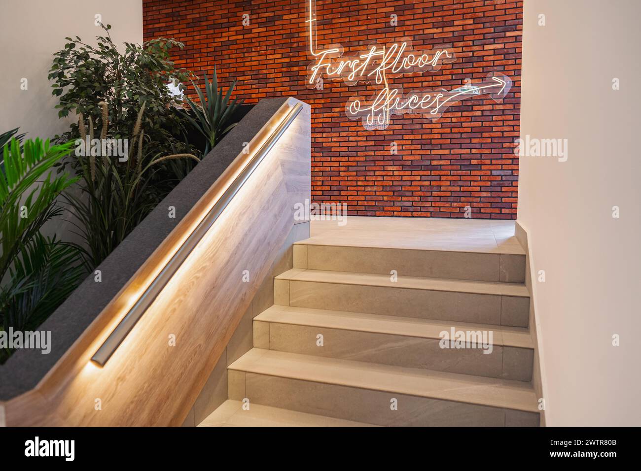 Brick Wall With Sign Next to Stairs Stock Photo - Alamy