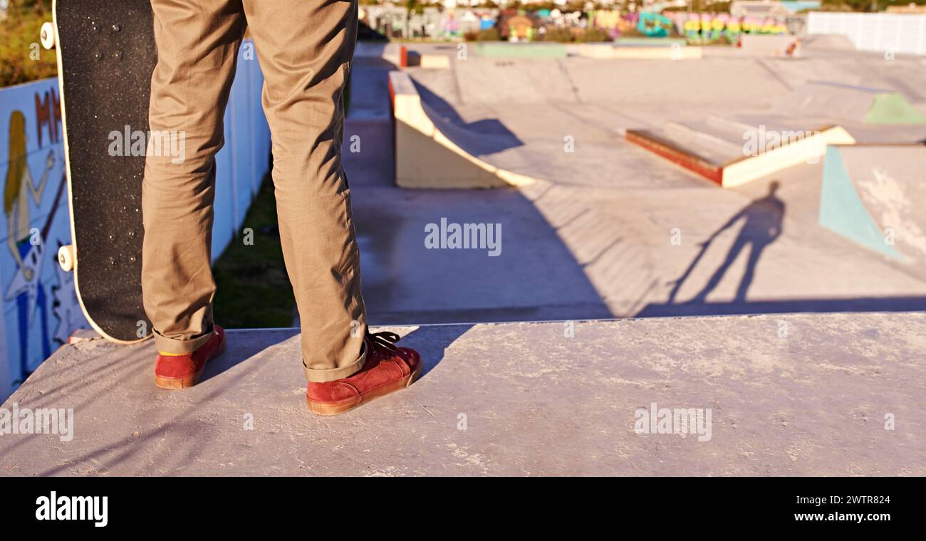 Man, legs and skateboard for hobby at skatepark with practice or ...