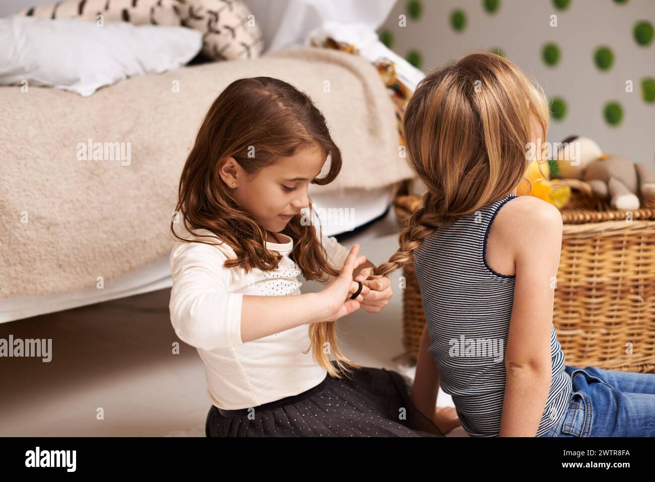 Girl child, hair and braid for sister, bedroom and bonding in home with ...