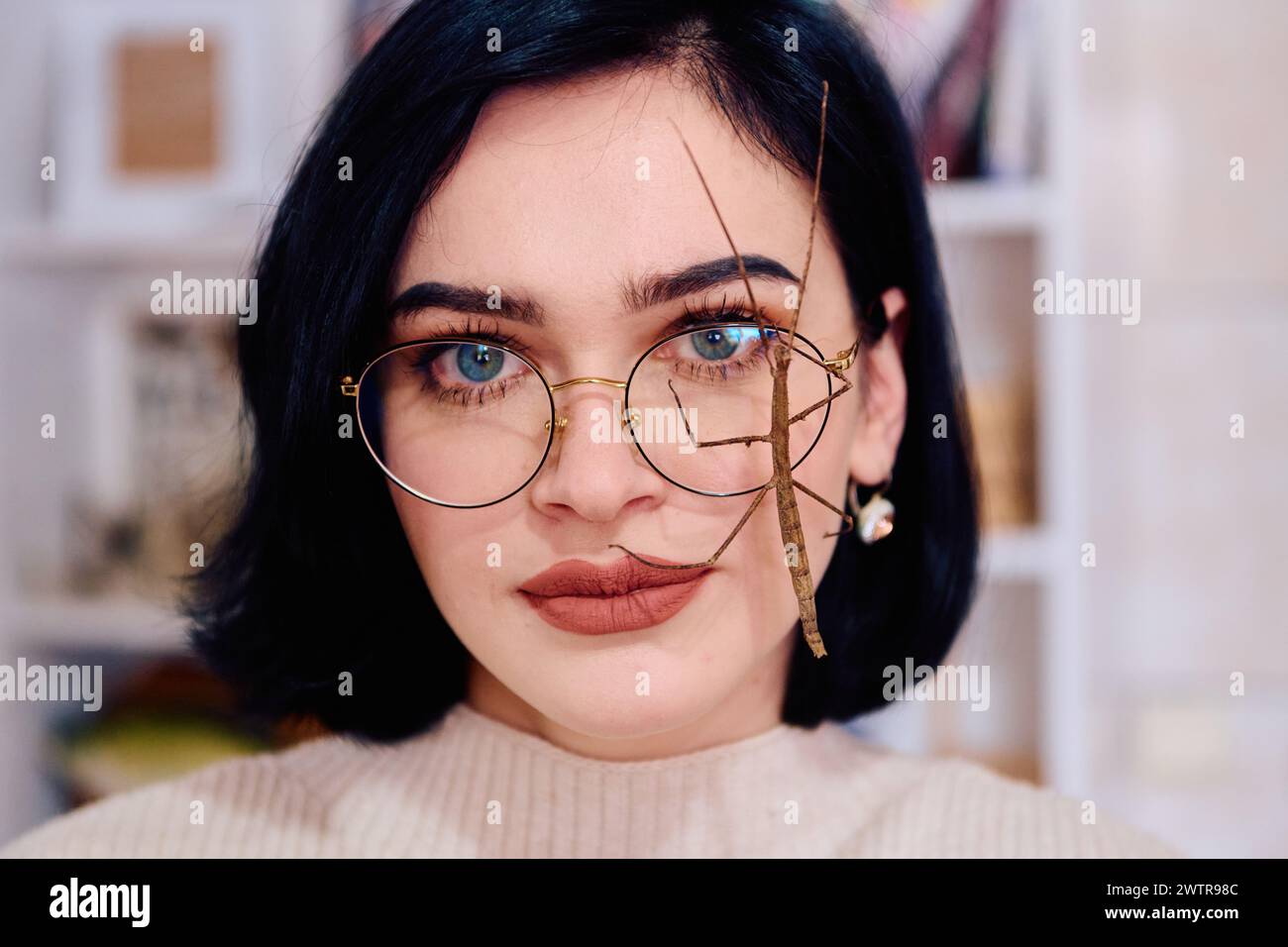 Young Woman Captured in a Beautiful Moment with Her Stick Insect ...