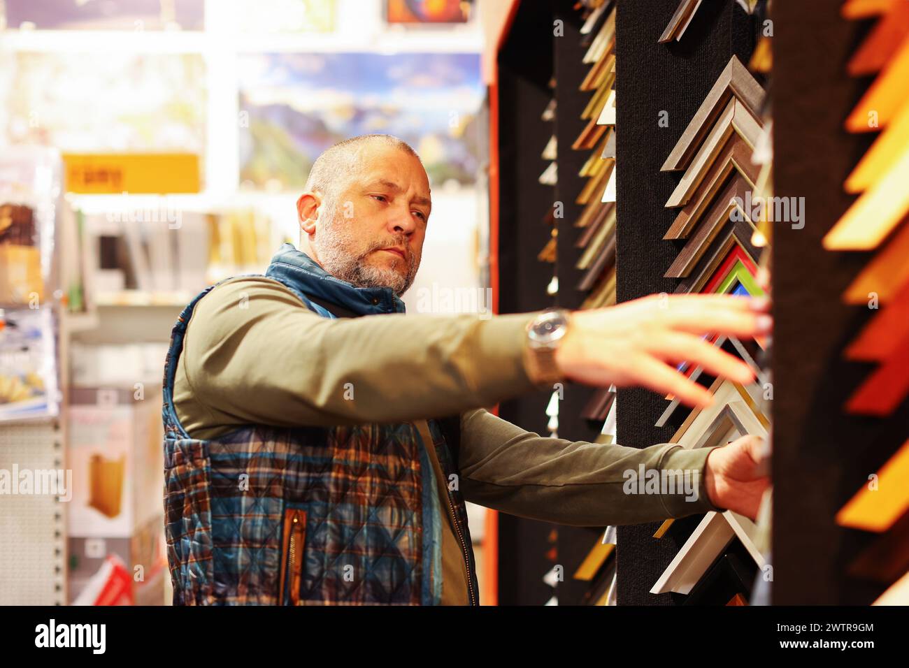 Man choose in Baguette shop close-up of different types of baguette in ...