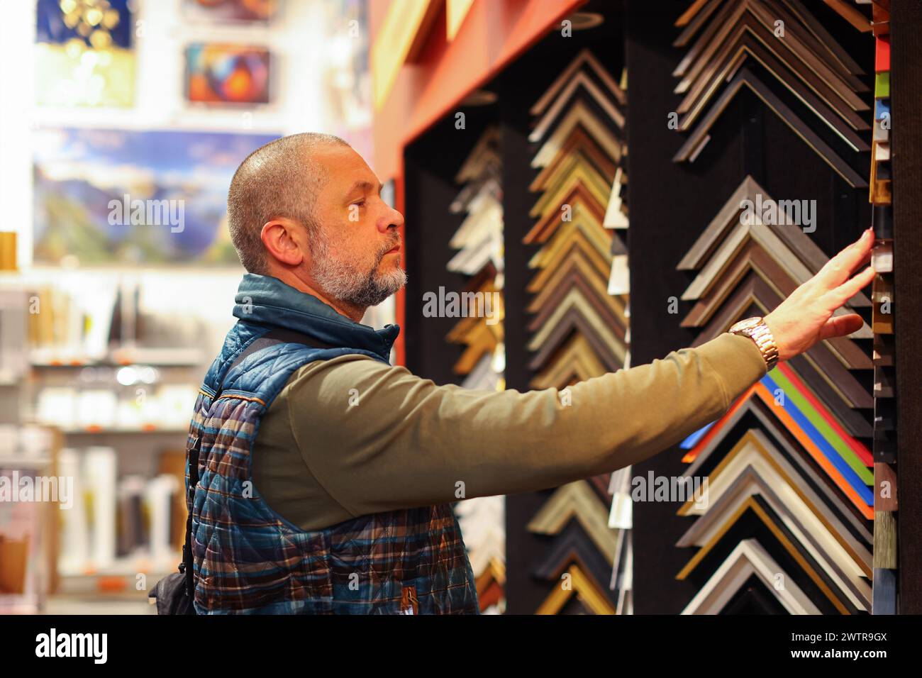 Man choose in Baguette shop close-up of different types of baguette in ...
