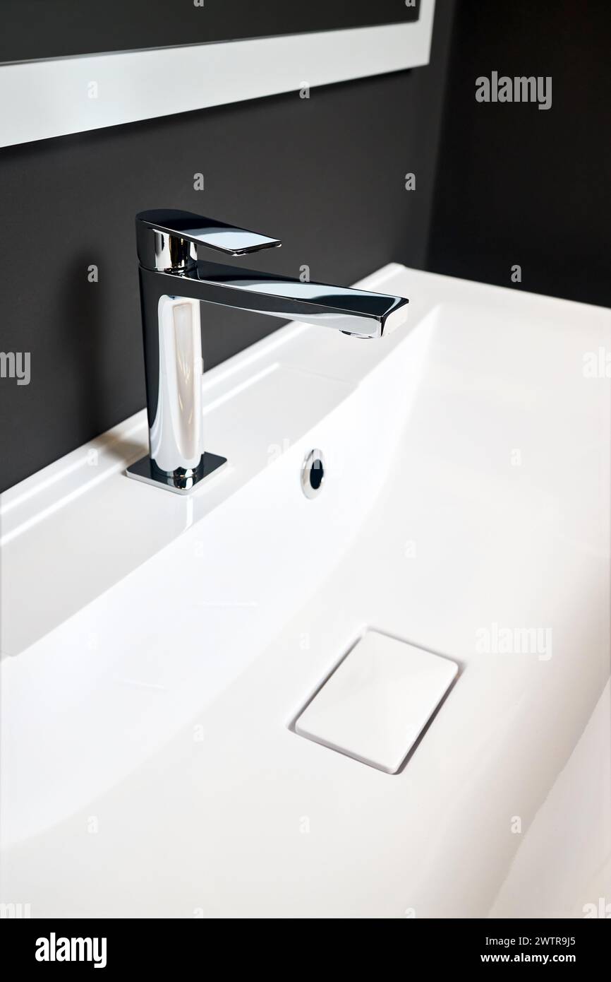 Interior detail of bathroom with washbasin sink with square drain and ...
