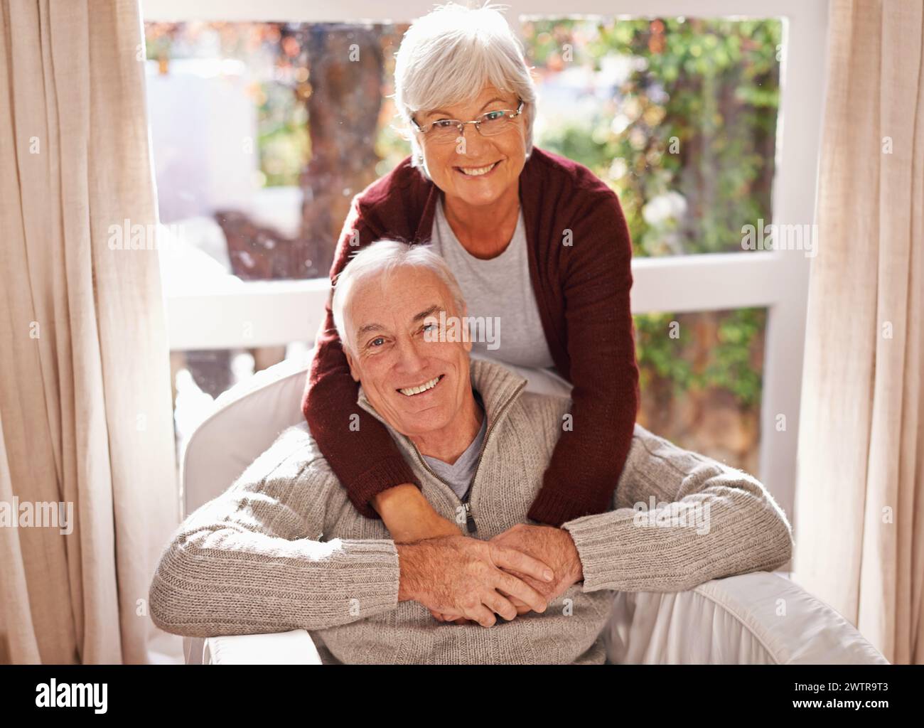 Couple, senior and portrait with hug, window and home for happy ...