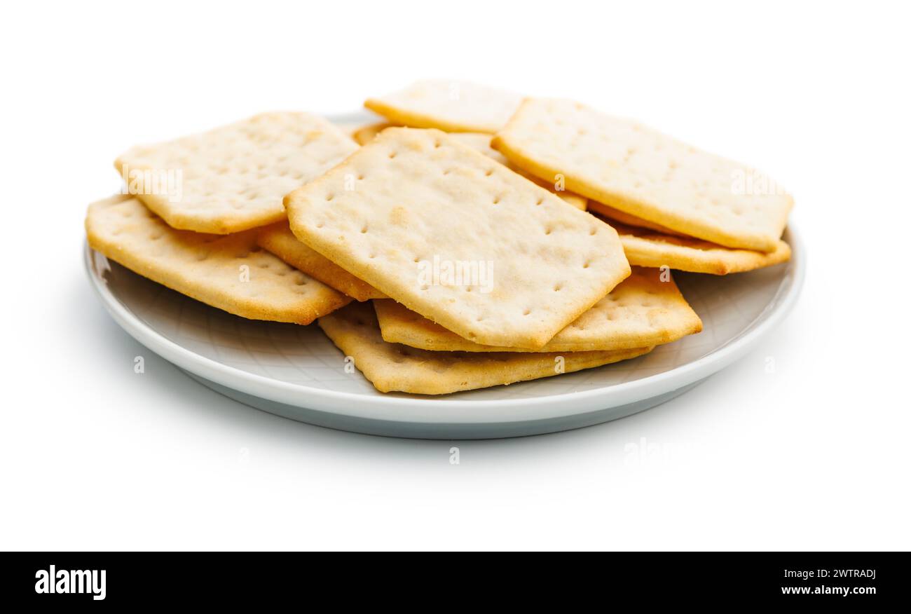 Crackers on a plate. Isolated on white background Stock Photo - Alamy