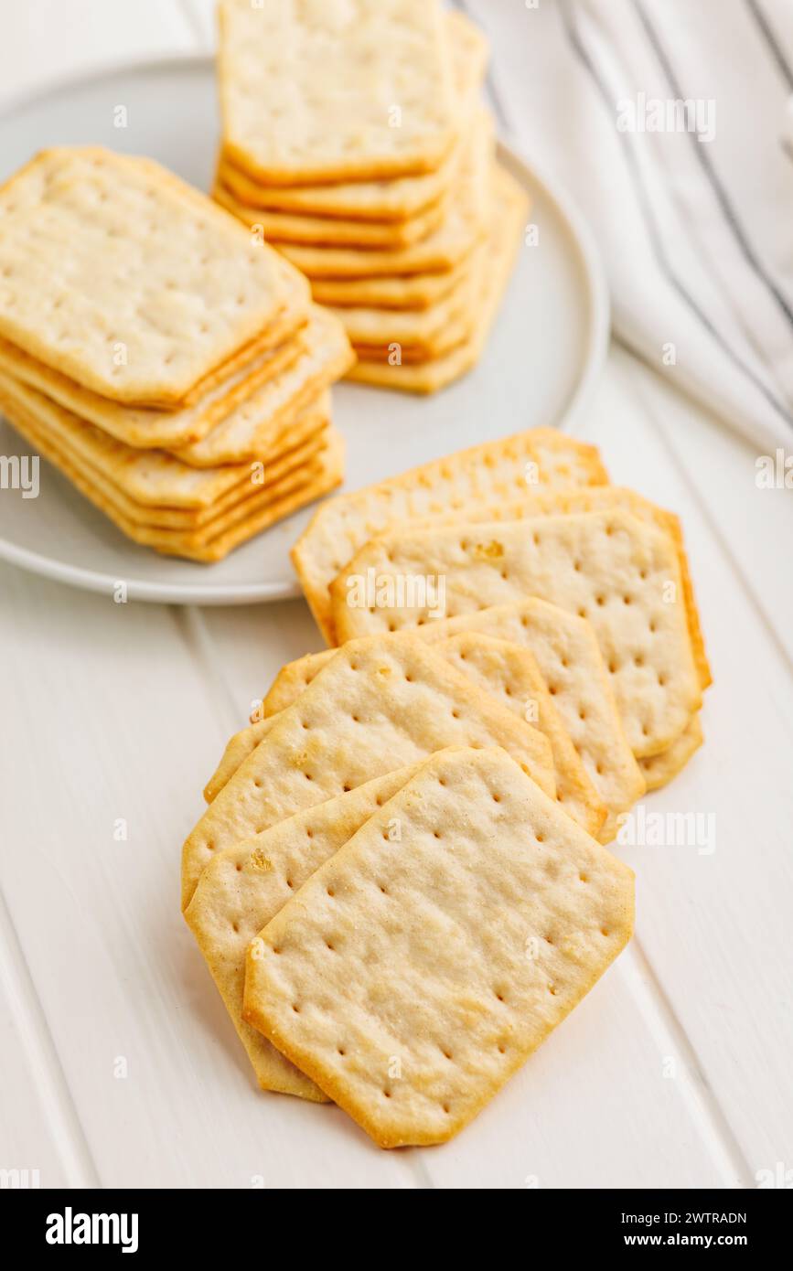 Salted Crackers on a White Table Stock Photo - Alamy