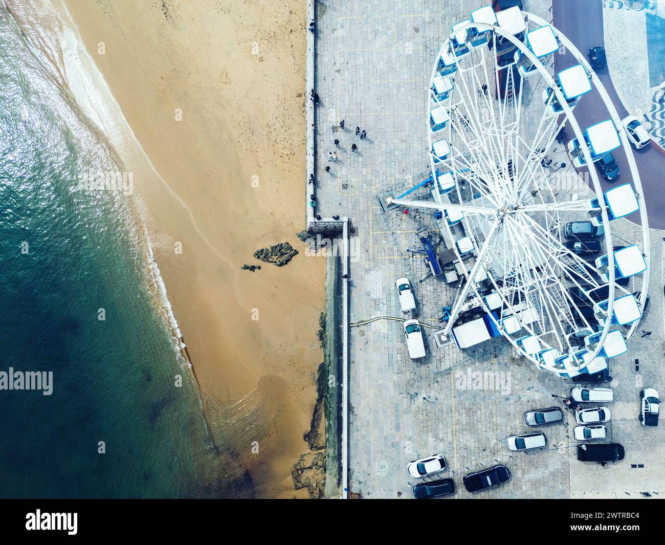 An aerial perspective showcases a towering Ferris wheel positioned ...