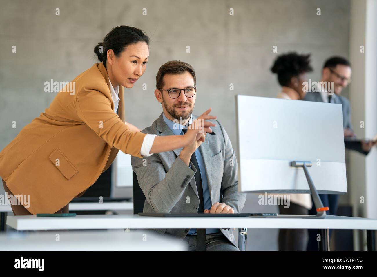Business men with colleague traders at office monitoring stocks data on ...