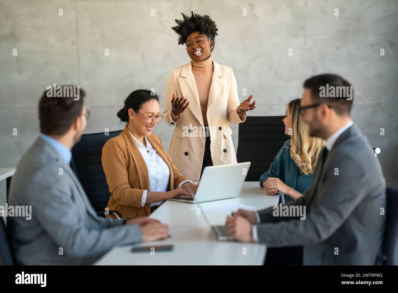 Team leader discussing and brainstorming new approaches and ideas with ...