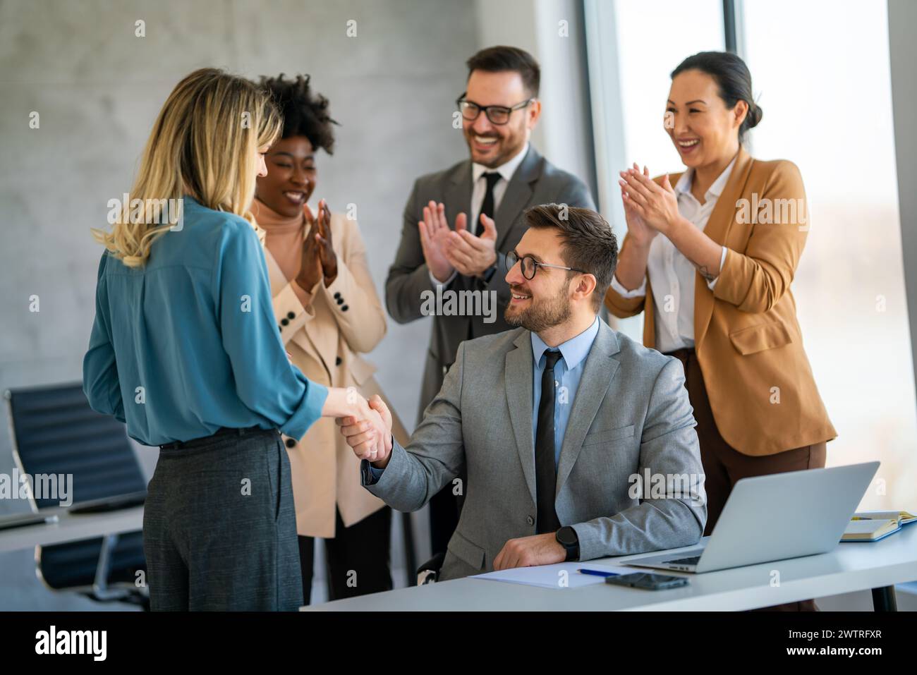 Nice to meet you in our team. Friendly man leader boss shake hand of ...