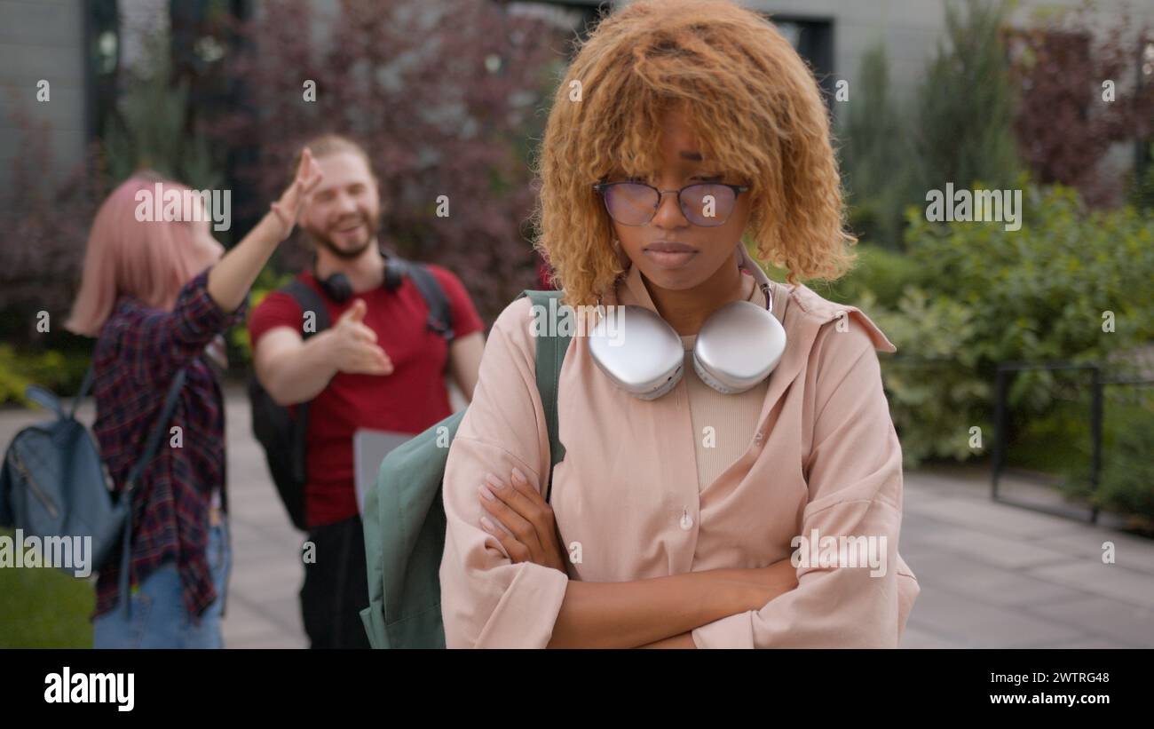 Group of angry students teenagers multiracial classmates mock humiliate ...