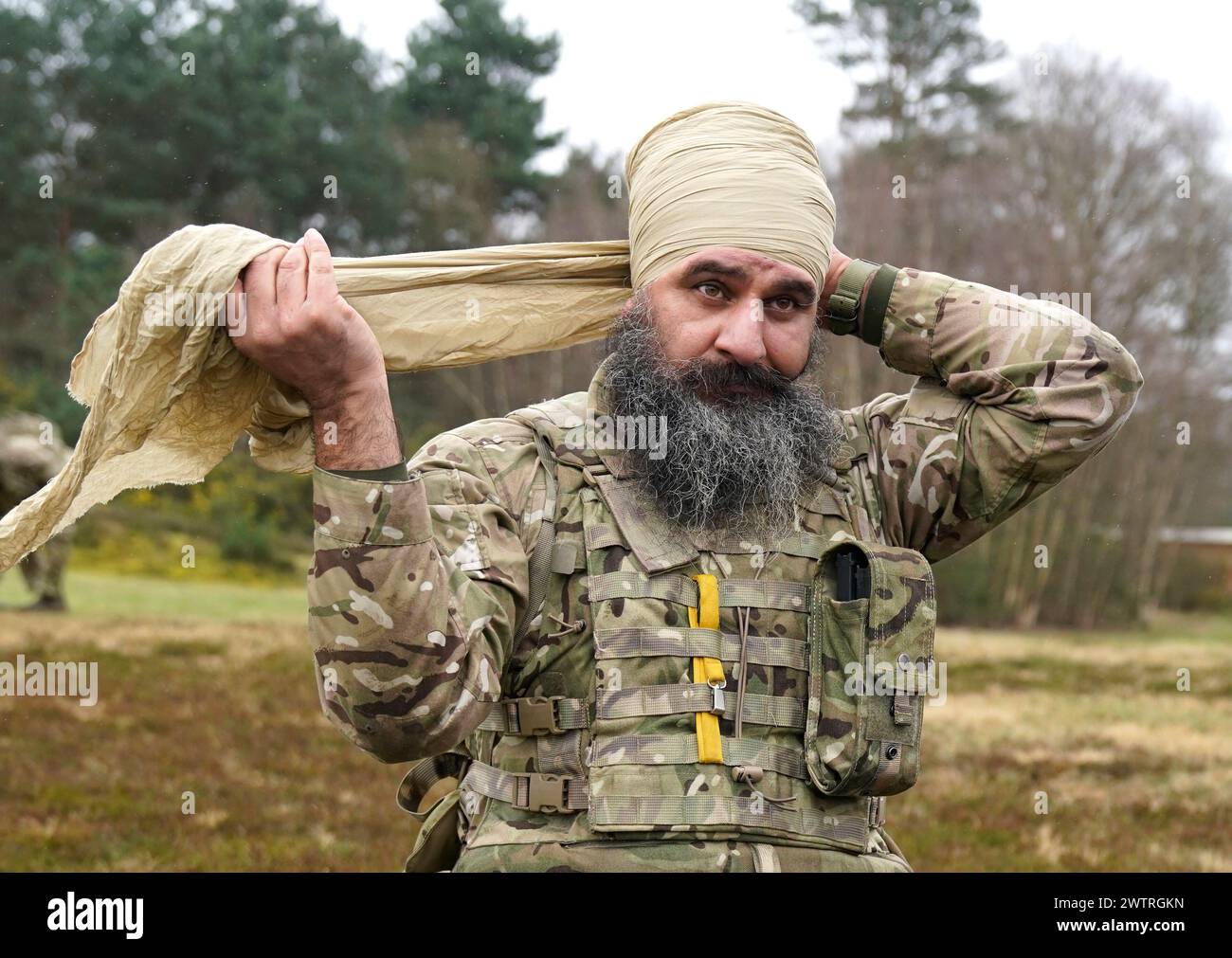 Major Harj Singh Shergill ties a Dumalla after taking part in a ...