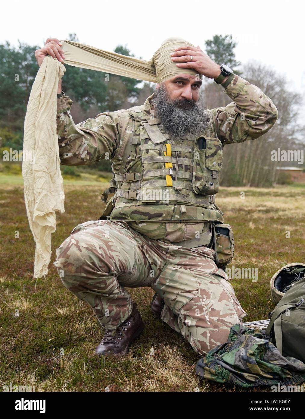 Major Harj Singh Shergill ties a Dumalla after taking part in a ...
