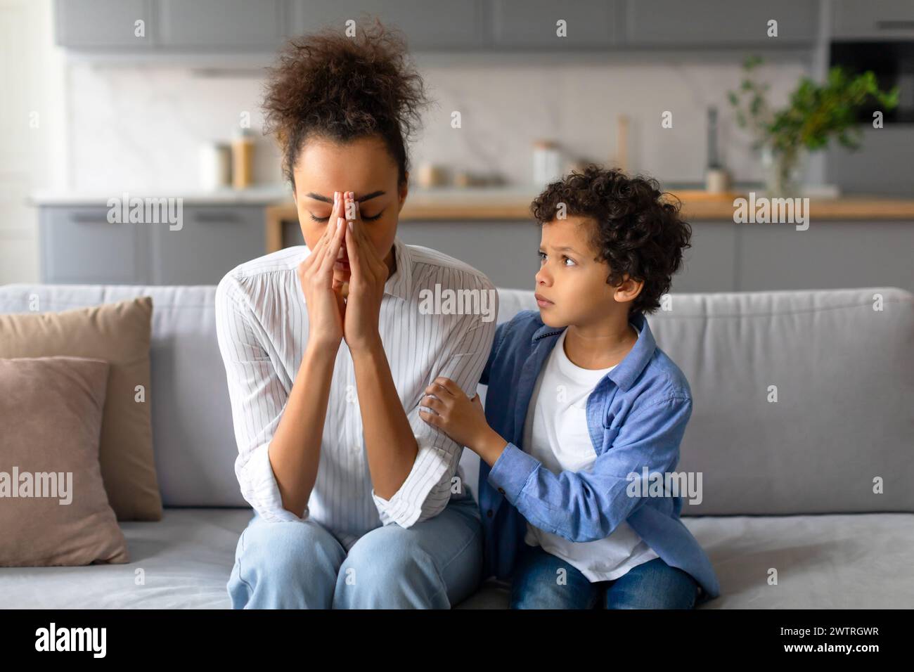 Mother distressed with son showing empathy Stock Photo - Alamy