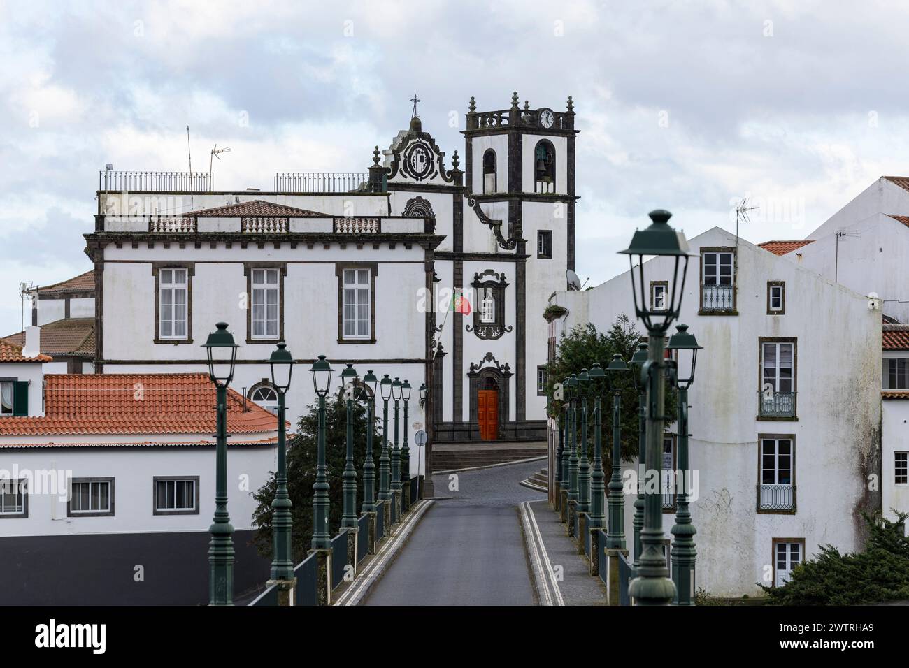 View of Nordeste old stone arch bridge in Nordeste village with white ...