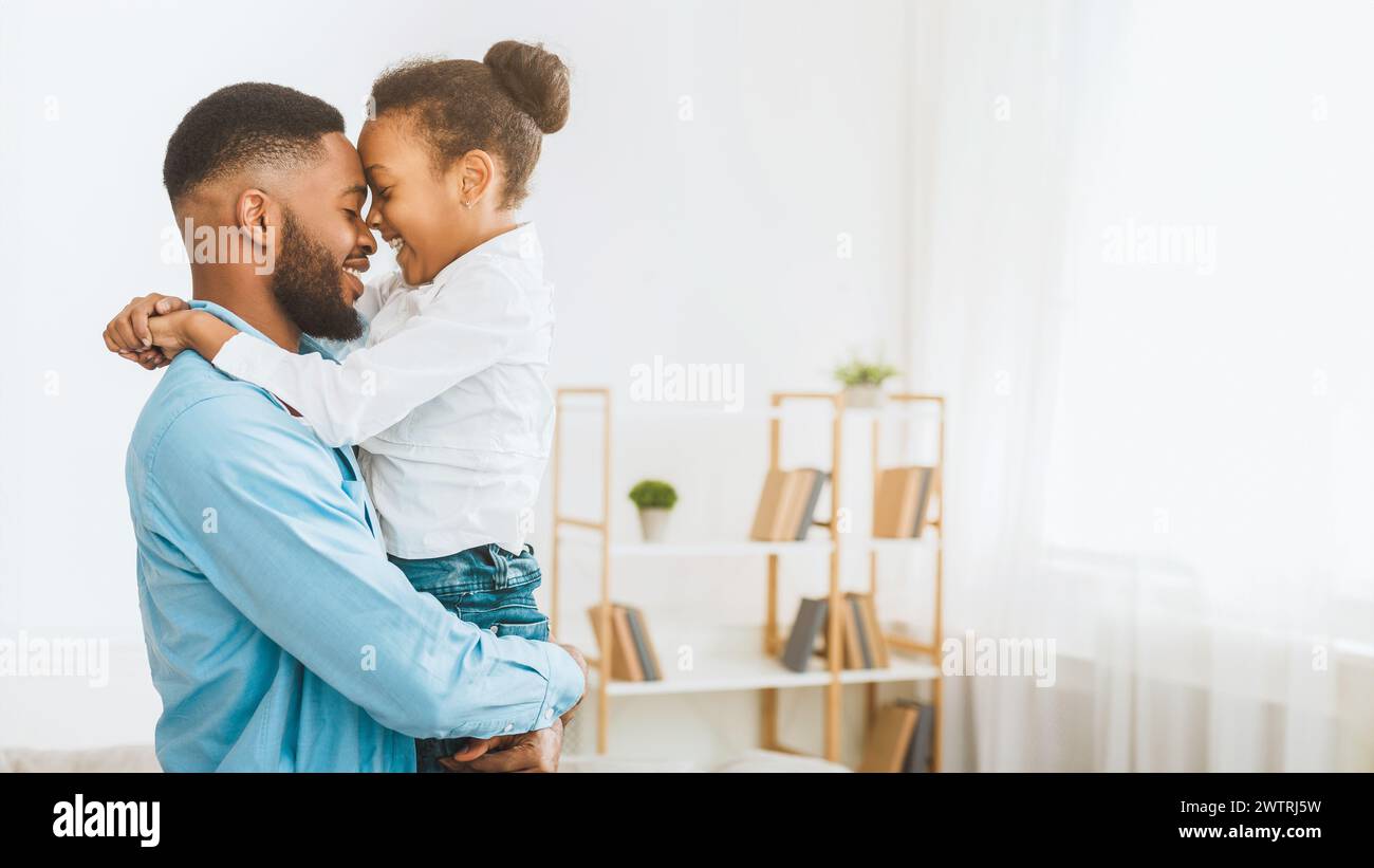 Happy father and daughter head to head portrait Stock Photo - Alamy