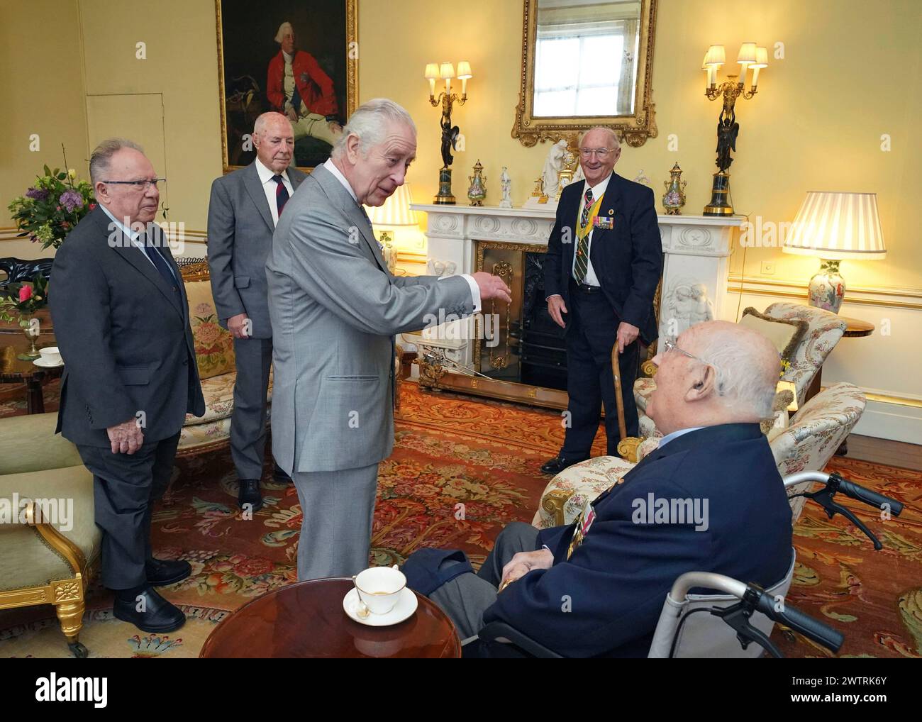 Britain's King Charles III, centre, gestures during an audience with ...