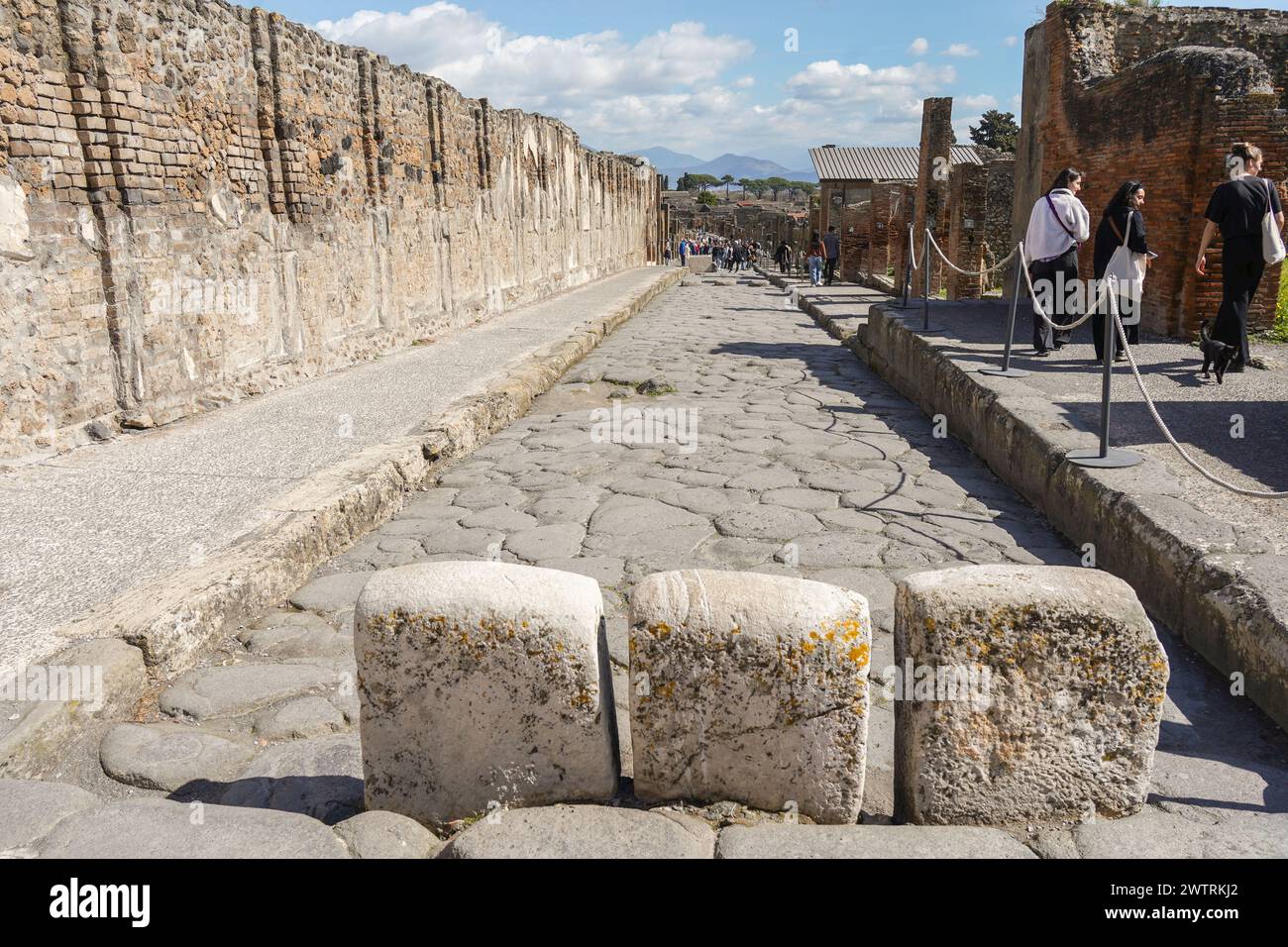 Pompeii Italy, Street in ancient Pompeii, paved during Roman times with ...