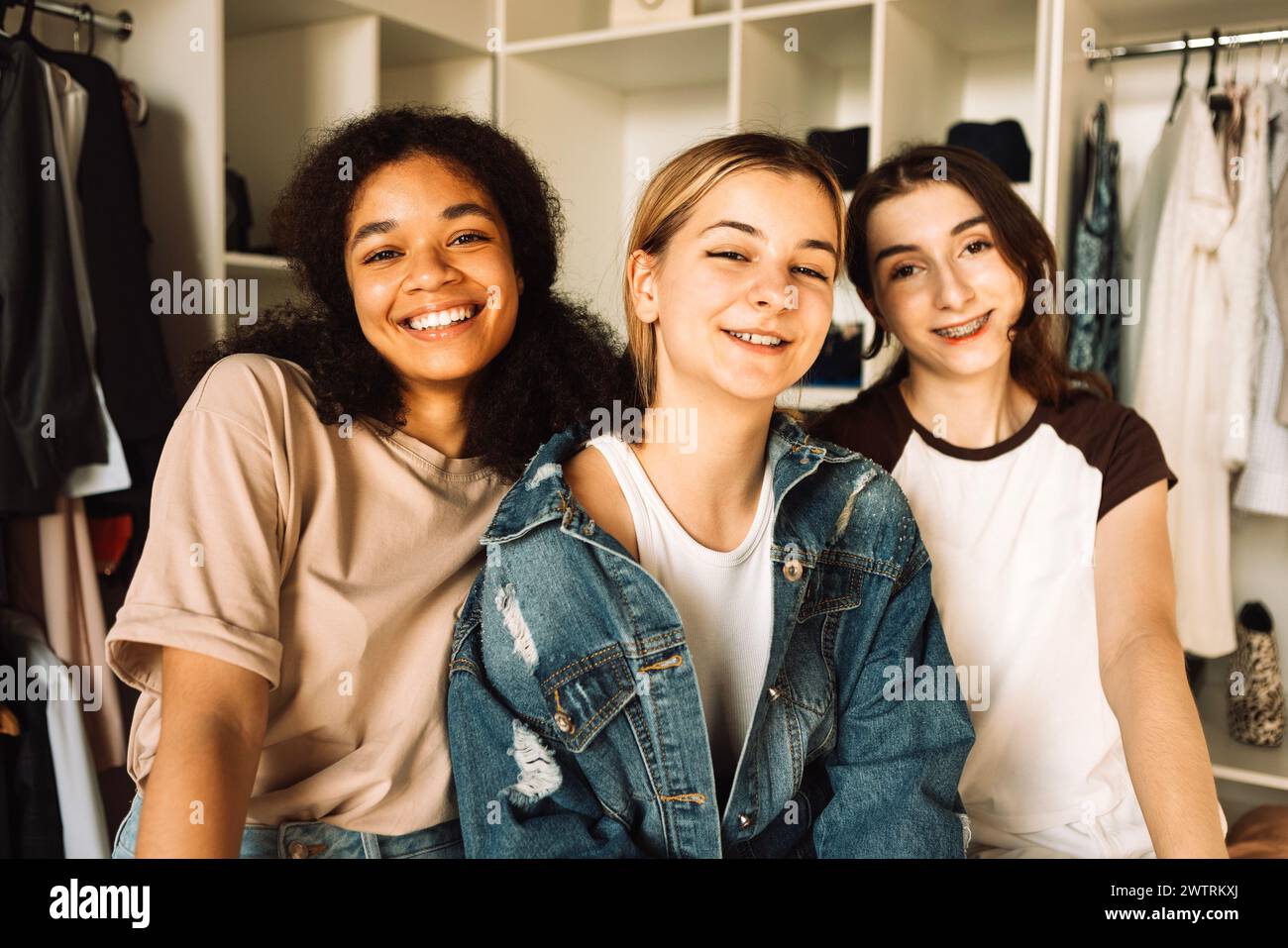 Close-up of three cute girls of different races and nationalities in ...