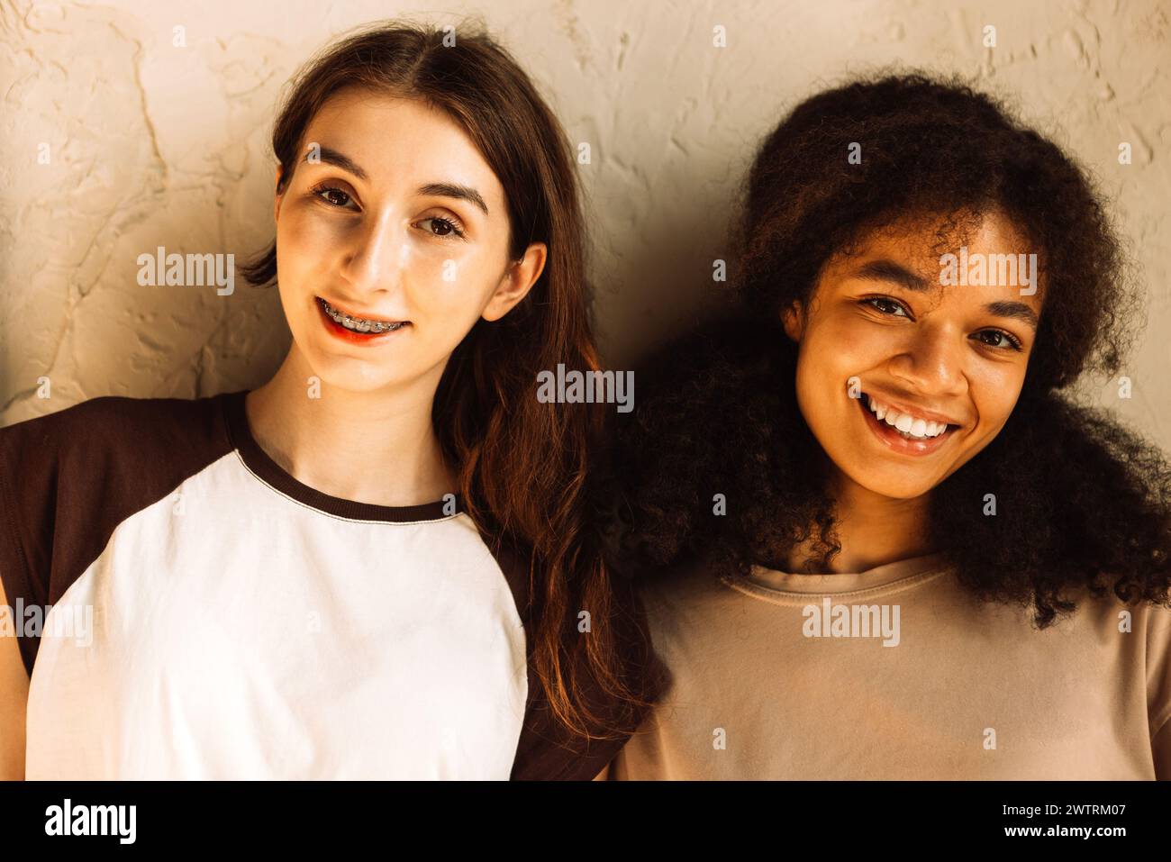 Close up of portrait of happy cute girls of different races are ...