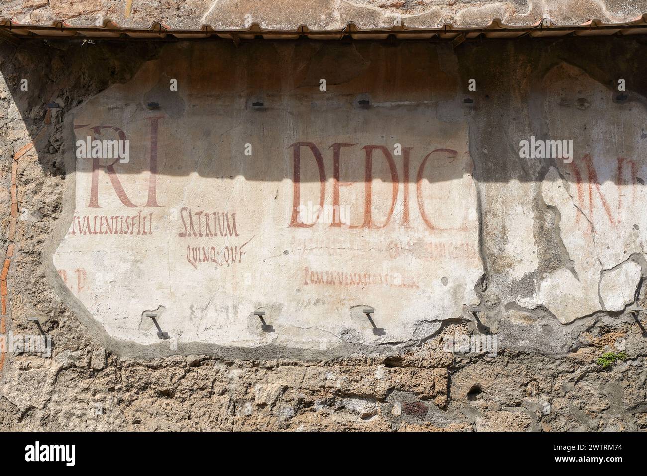 Ancient roman written signage in the streets of Pompeii, Naples, Italy ...