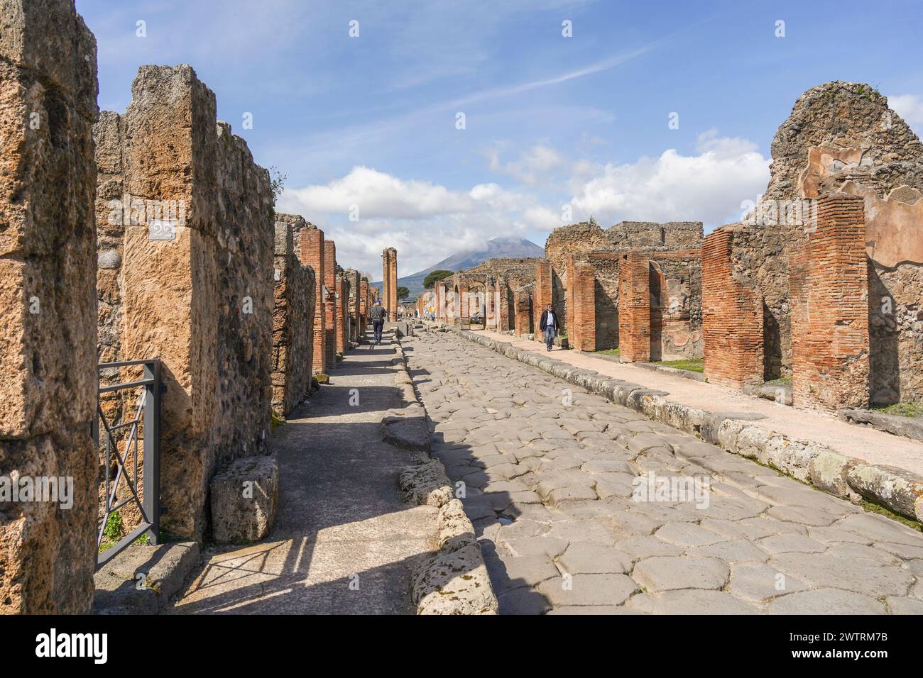 Pompeii Italy, Street in ancient Pompeii, paved during Roman times with ...