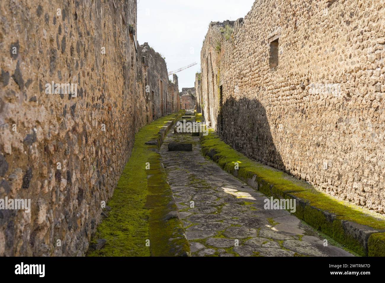 Pompeii Italy, Street in ancient Pompeii, paved during Roman times with ...