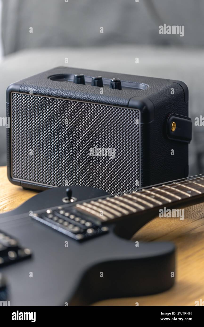 Black electric guitar and speaker close-up. Guitar amplifier, musical ...