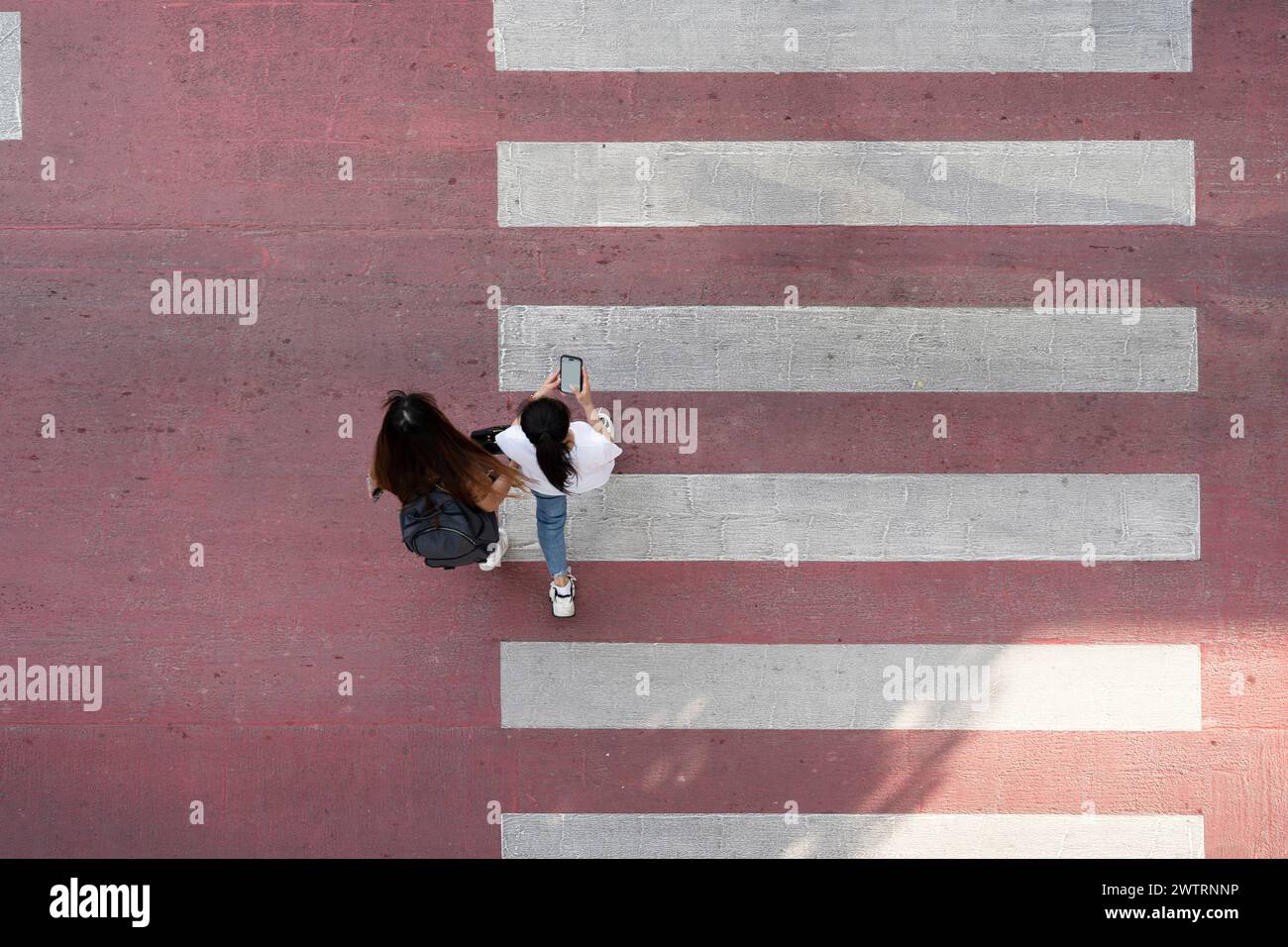 Aerial photo top view of people walk on street in the city over ...