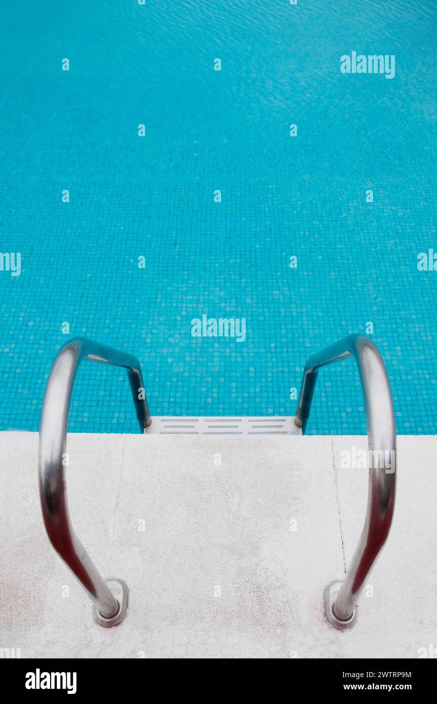 Ladder in swimming pool Stock Photo - Alamy