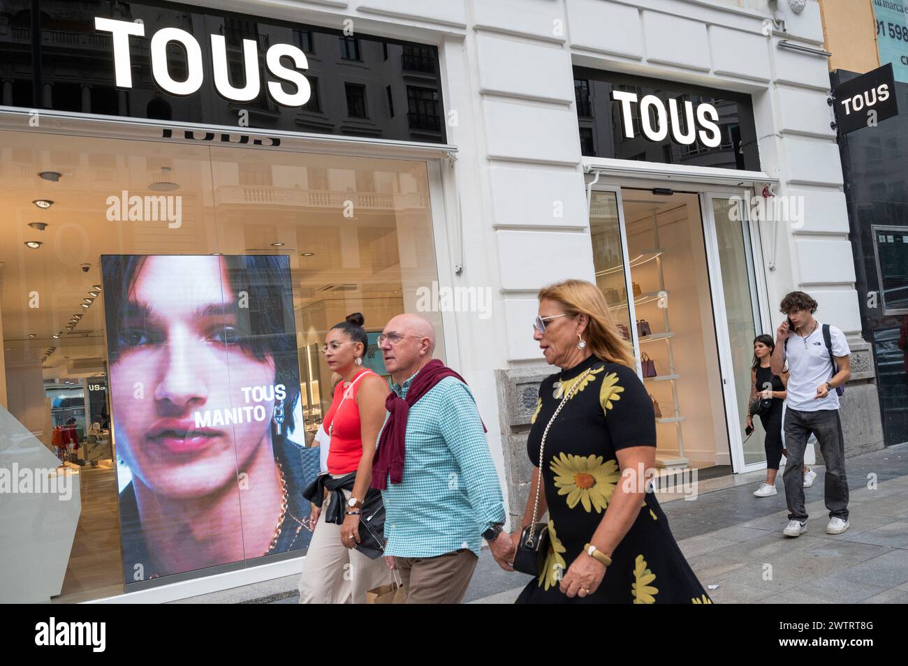 Pedestrians and shoppers walk past the Spanish jewelry, accessories ...