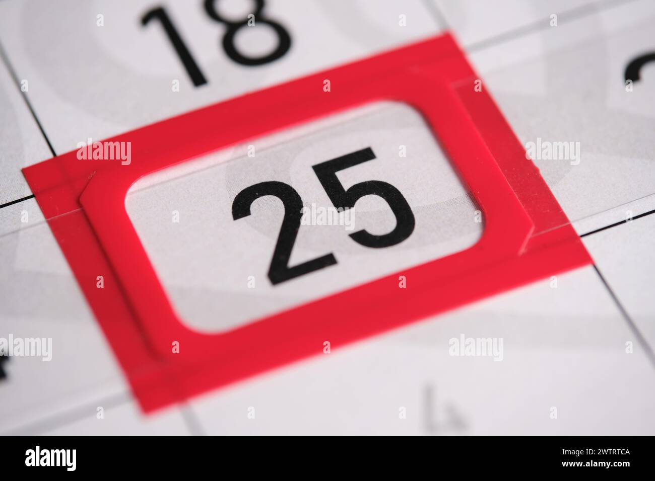 Calendar date. The 25th number the calendar is highlighted in a red ...