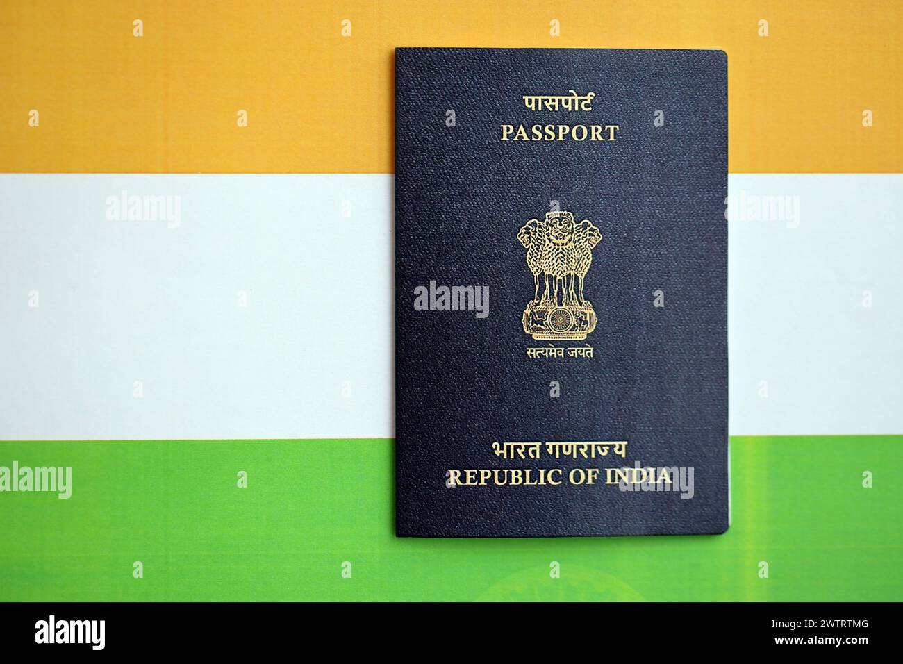 Blue Indian passport on national flag background close up. Tourism and ...