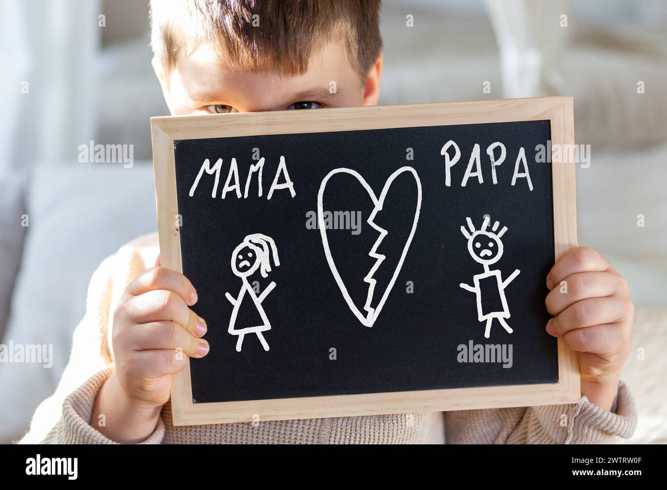19 March 2024: Little boy holding a board with a drawing about his ...