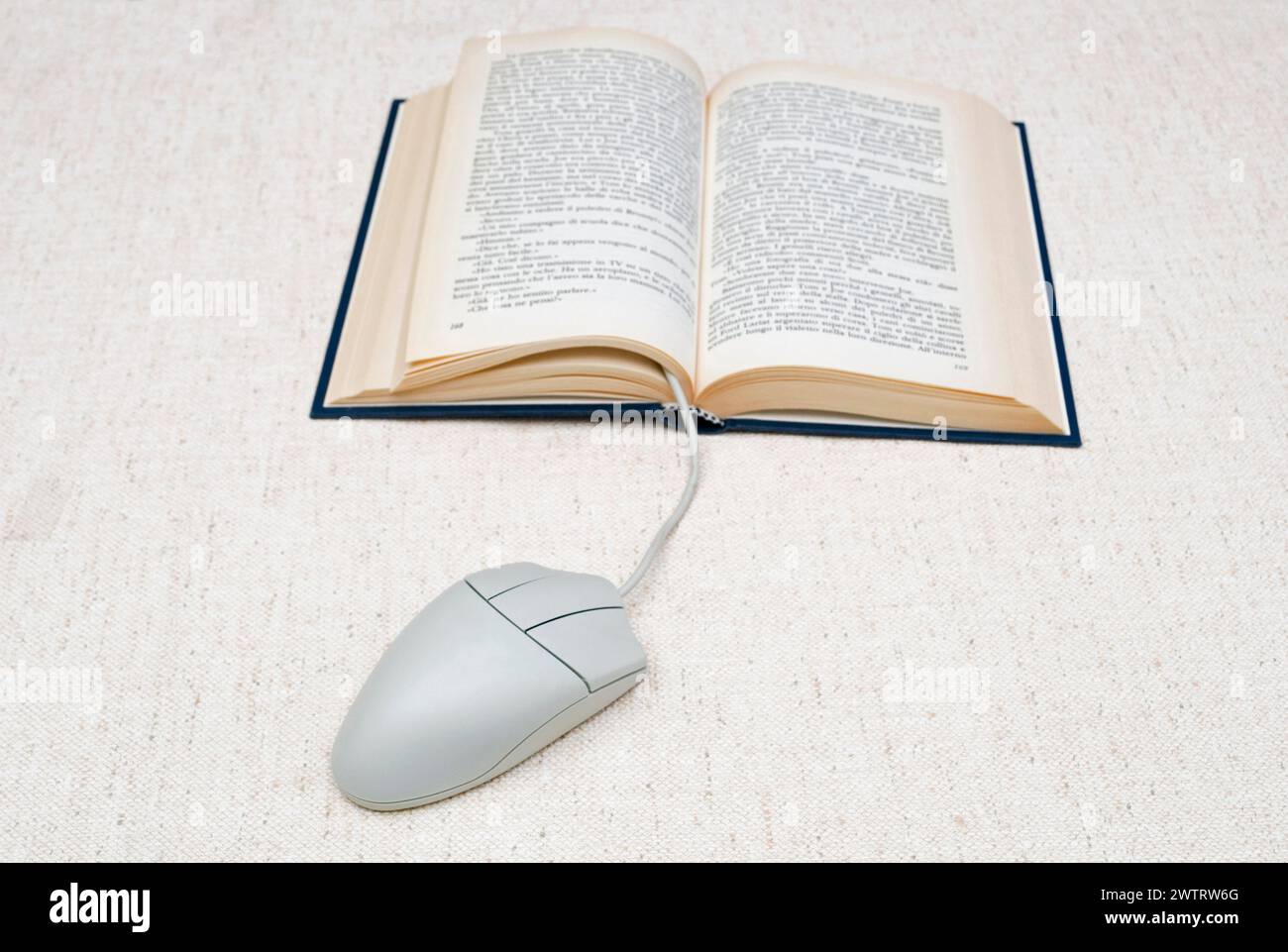 Computer mouse and book Stock Photo - Alamy
